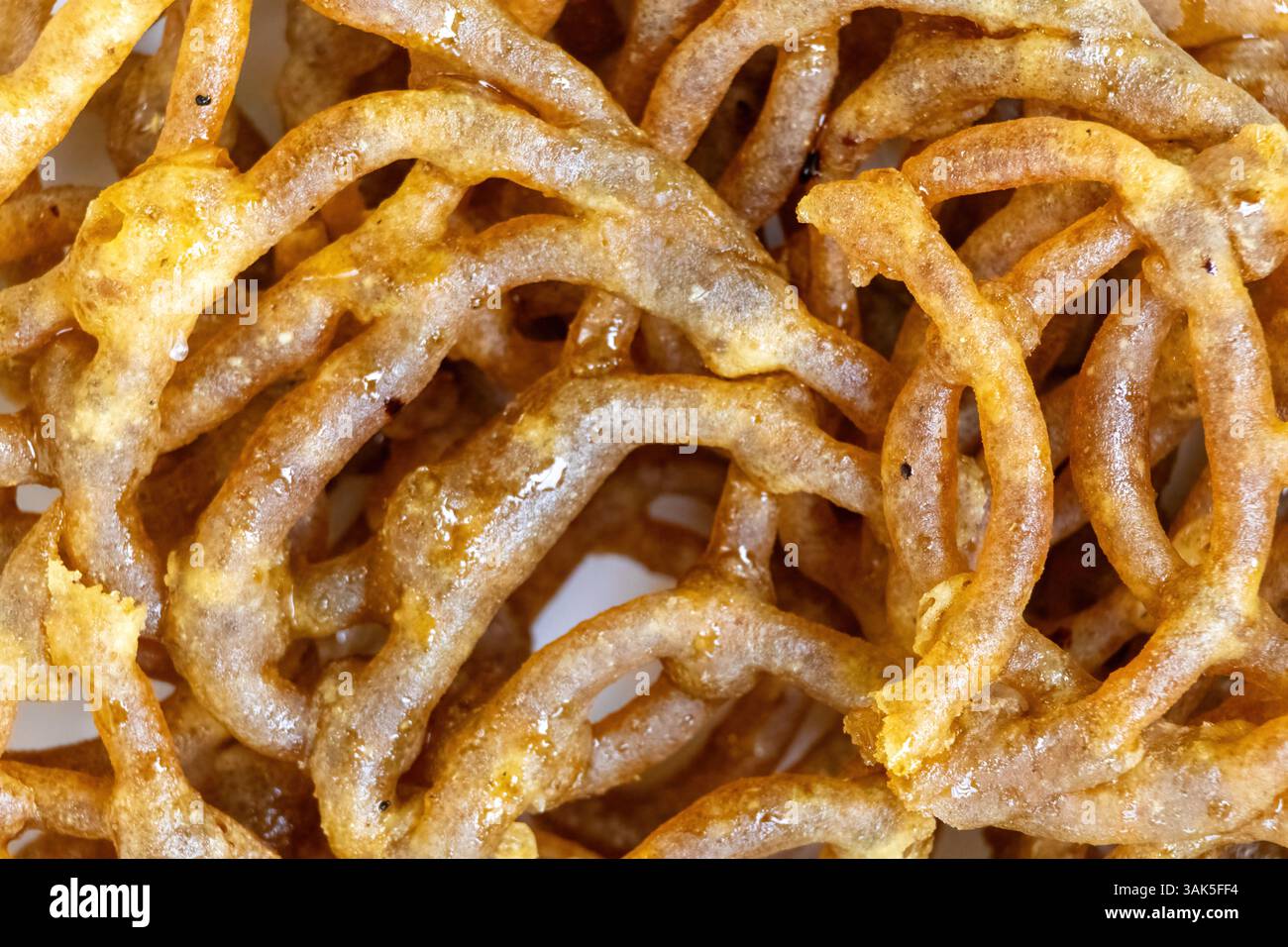 Close-up background of delicious, juicy Shahi jilapi or jalebi texture ...