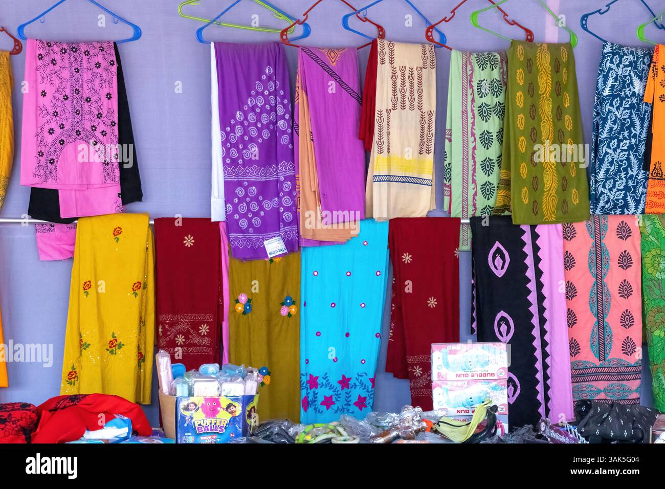 Colorful three-piece cotton textile clothes for women on hangers for ...