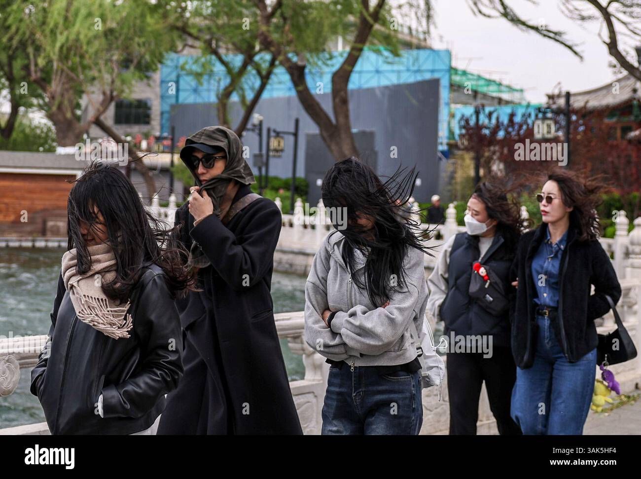 Beijing, China. 12th Apr, 2025. People walk at Shichahai scenic area in ...