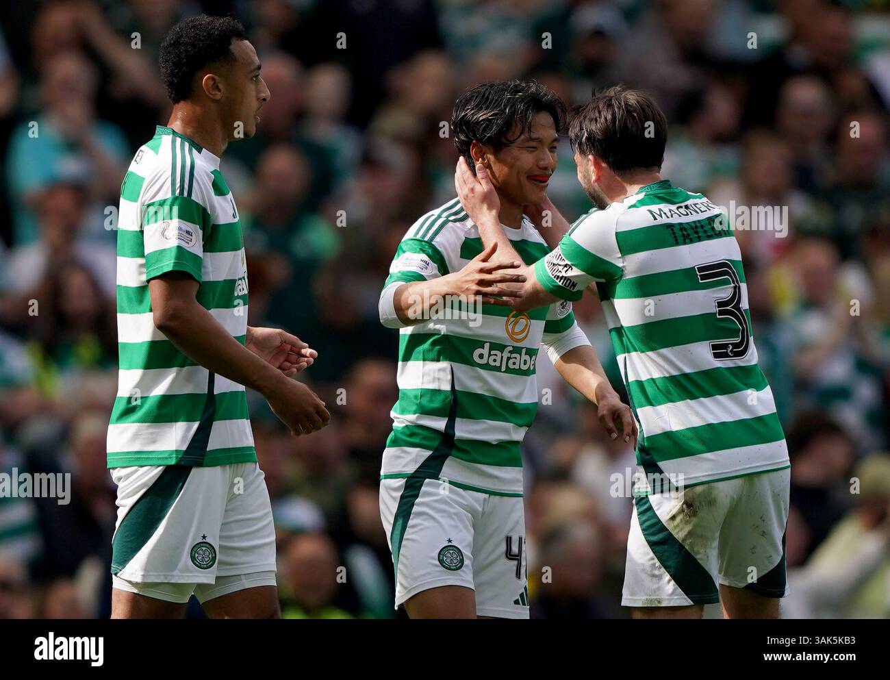Celtic's Reo Hatate (centre) celebrates scoring his second goal and his ...