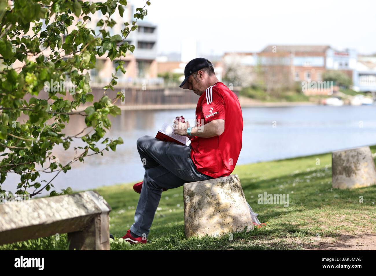 A Nottingham Forest fan reads the matchday programme ahead of the ...