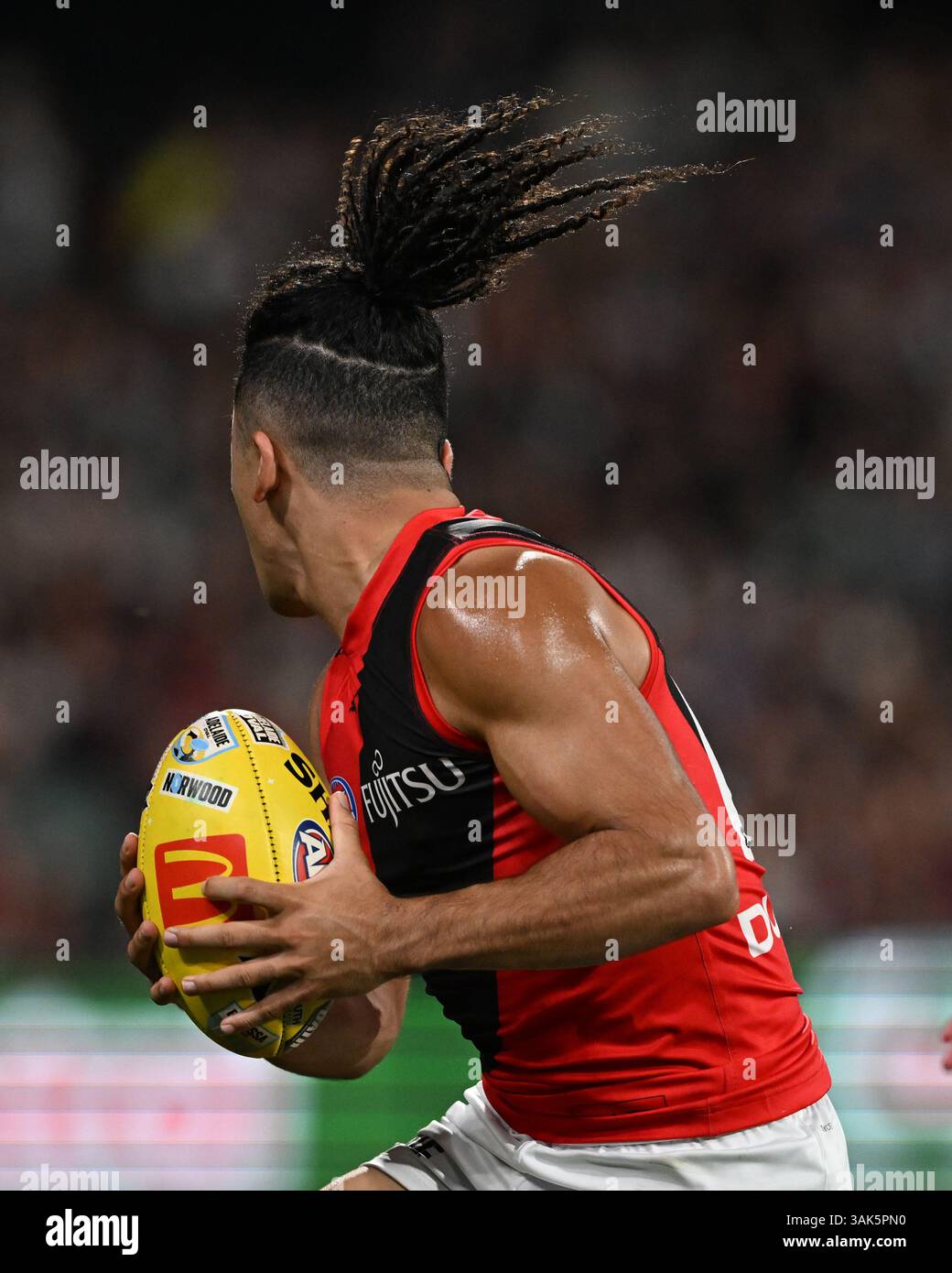 Adelaide, Australia. 12th Apr, 2025. The hair flies on Isaac Kako of ...