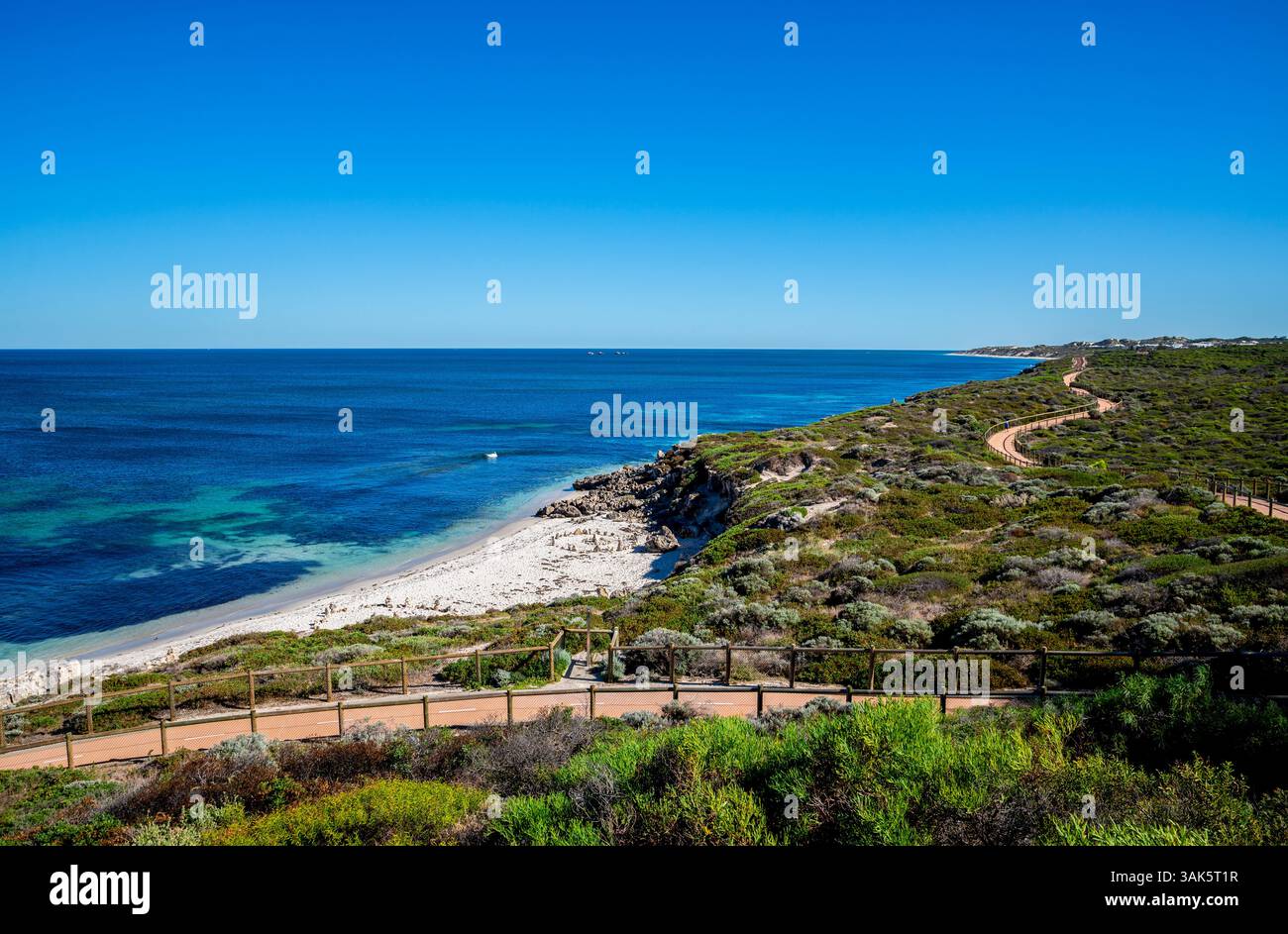 Coastal Trail Overlooking Clear Blue Ocean and Rugged Green Shoreline ...