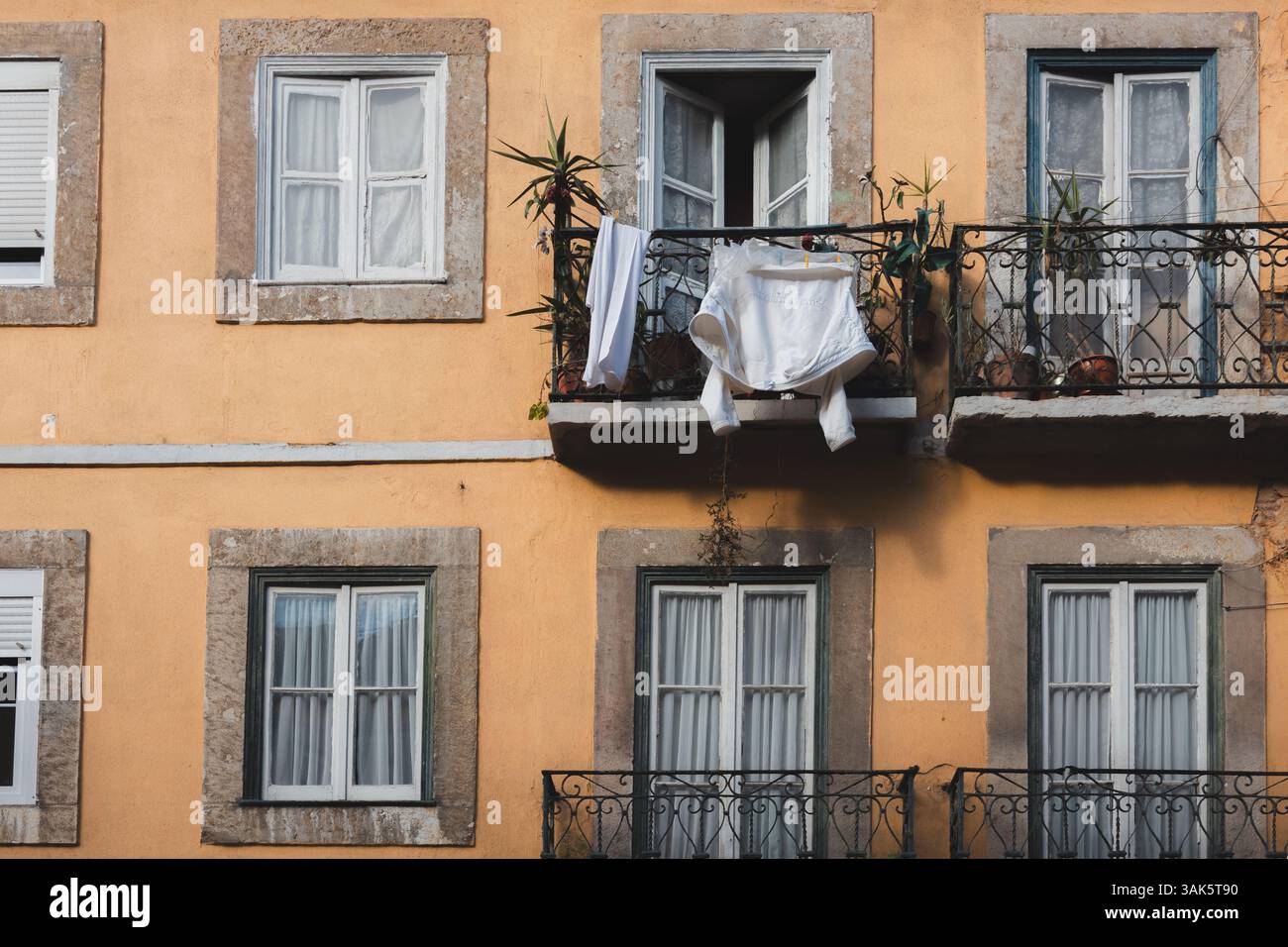 Laundry hangs to dry on a quaint balcony in Bairro Alto, Lisbon ...
