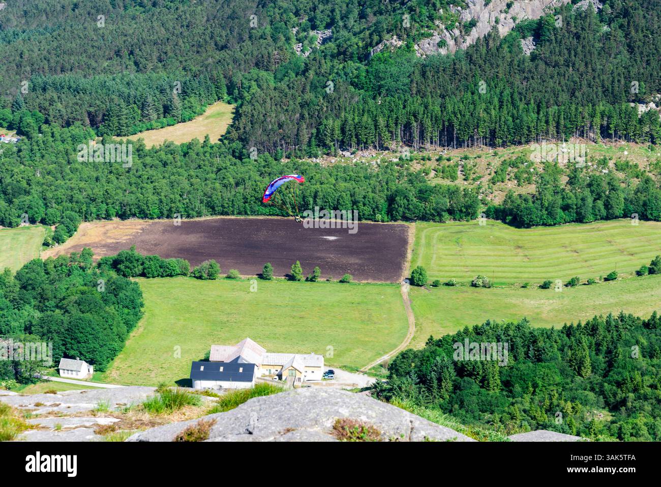 Peaceful Countryside View With Paraglider Over Fields and Forests as ...