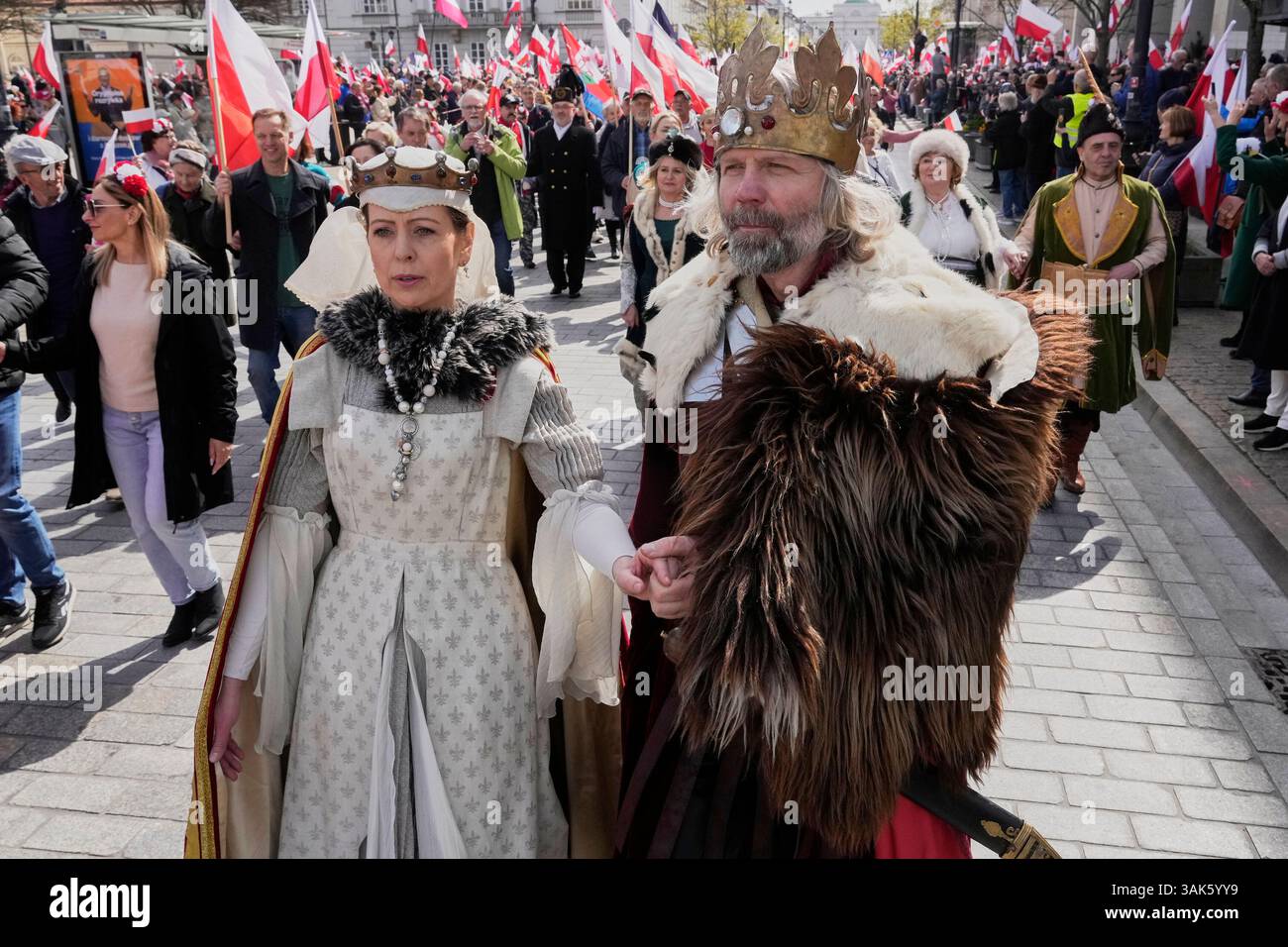 Poles dressed in historical outfits attend a patriotic demonstration ...