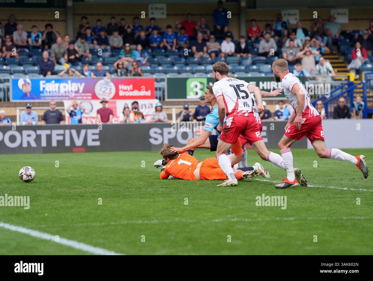 Wycombe Wanderers' Caleb Taylor (second left) scores during the Sky Bet ...