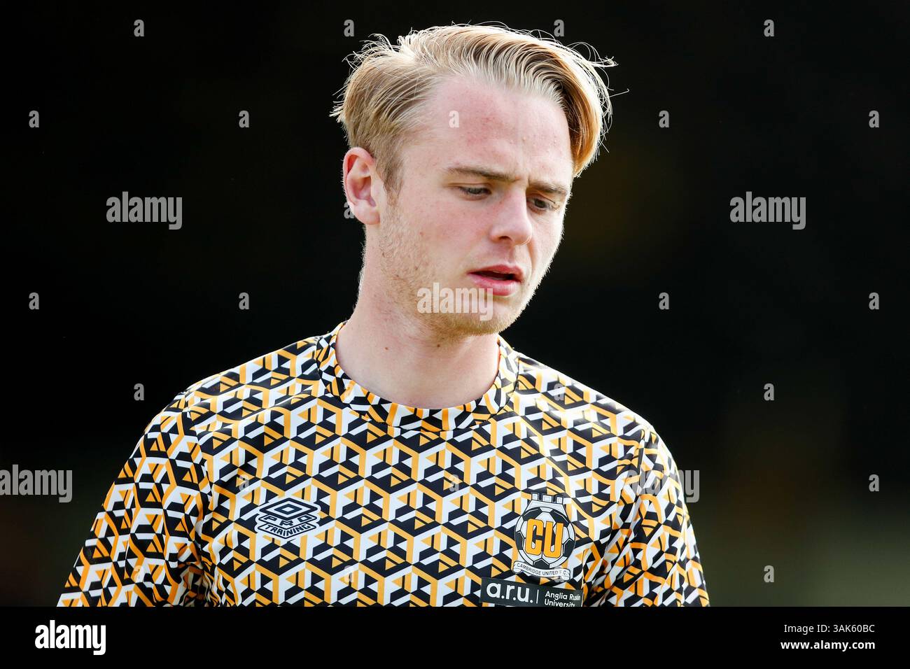 Cambridge, UK. 12th Apr, 2025. Liam Bennett of Cambridge United warms ...