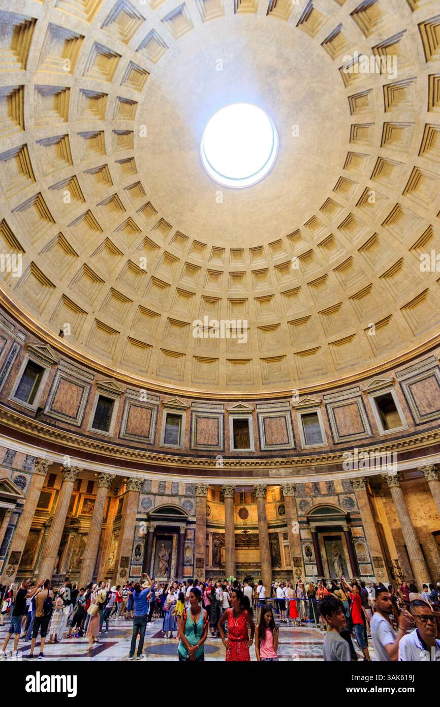 Crowded with tourists, the inside of the Roman Pantheon, now a church ...