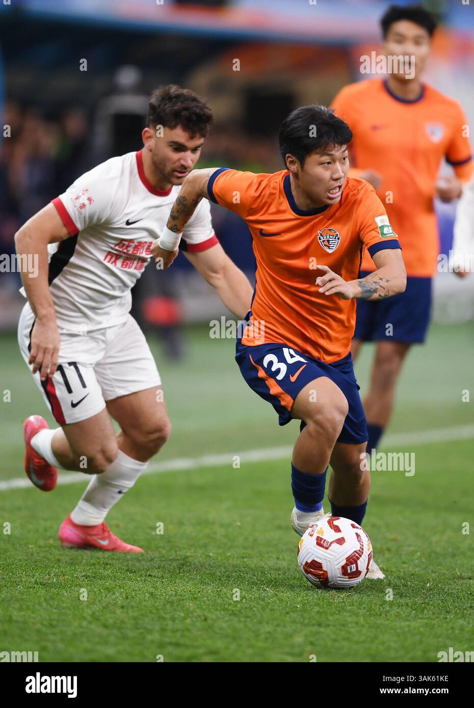 Qingdao, China's Shandong Province. 12th Apr, 2025. Jin Yonghao (Front ...