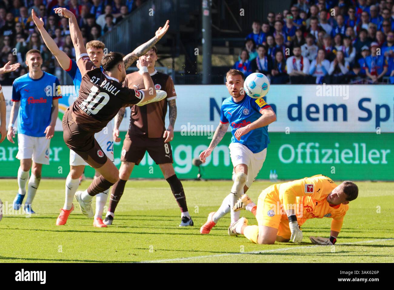 St. Pauli's Danel Sinani, 3rd left, scores their side's first goal of ...