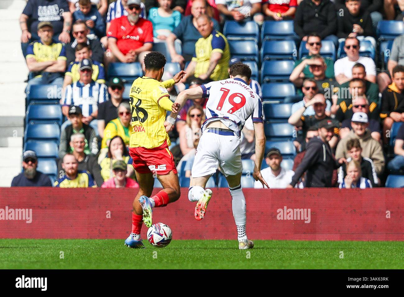 #26, Caleb Wiley of Watford & #19, Will Lankshear of WBA battle for ...