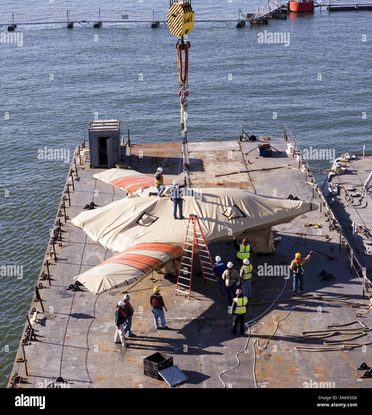 Aug. 7, 2012 - Contractors hoist the X-47B Unmanned Combat Air System ...