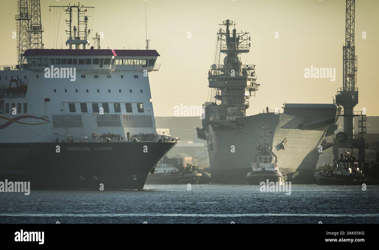 December 3, 2016 - ..A ferry (L) passes the former Royal Navy aircraft ...