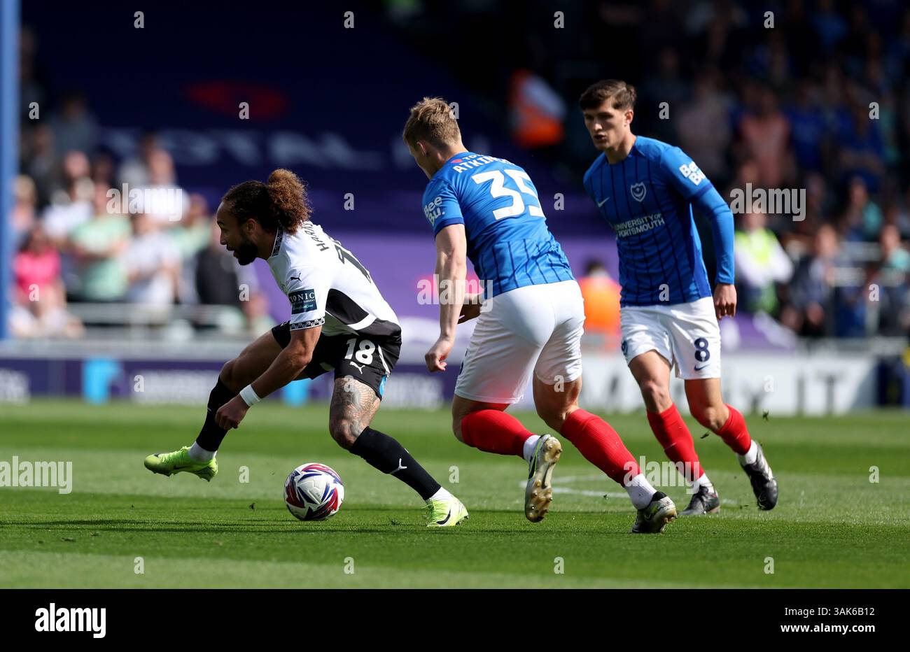 Derby County's Marcus Harness (left) and Portsmouth's Rob Atkinson ...