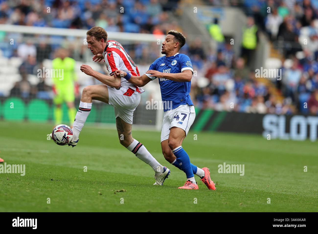 Cardiff, UK. 12th Apr, 2025. Wouter Burger of Stoke City holds off ...