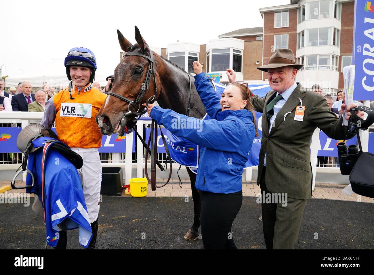 Jockey Harry Cobden (left) with horse Captain Cody (centre) and trainer ...