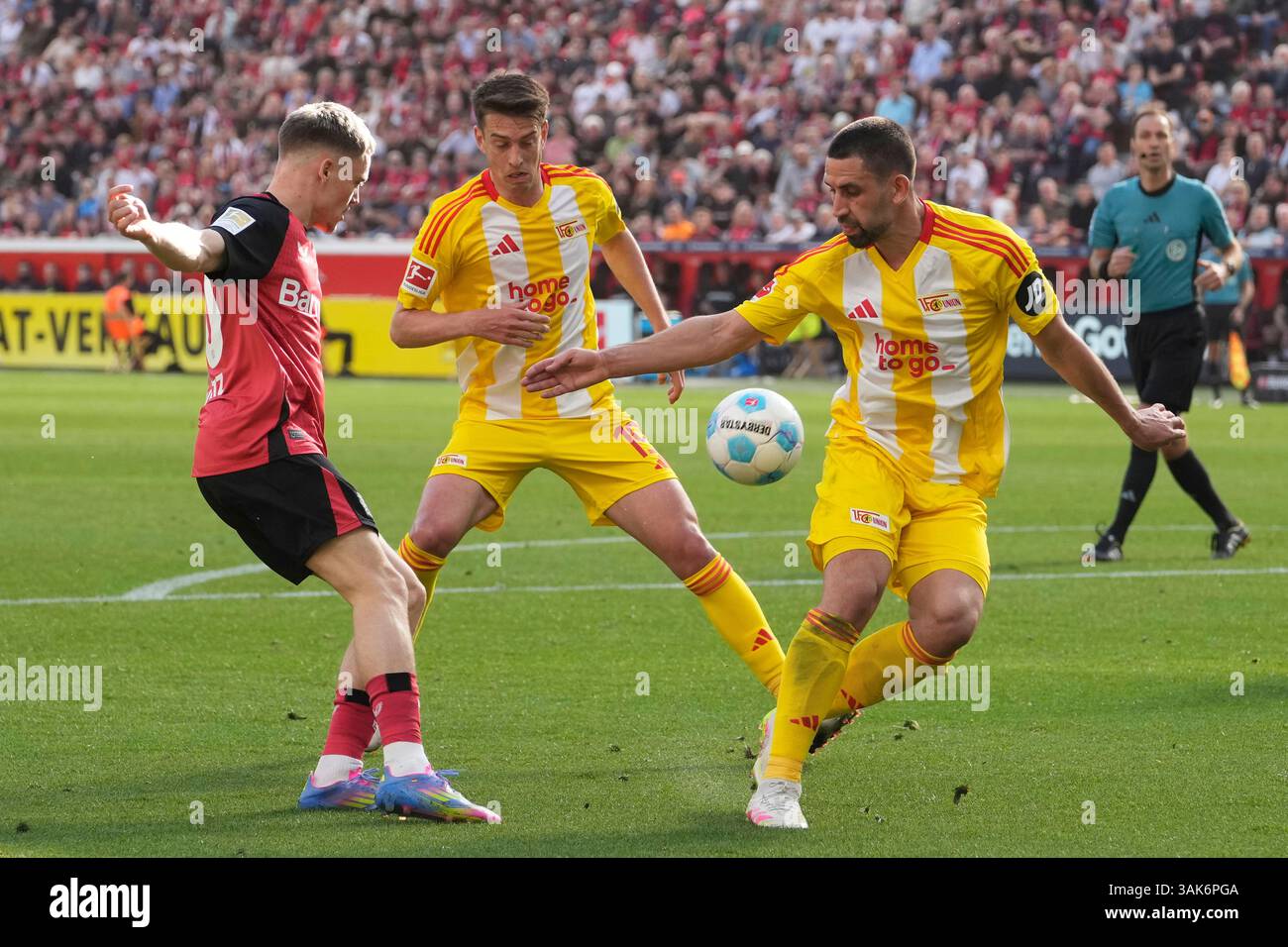 Leverkusen's Florian Wirtz, left, in action during the German ...