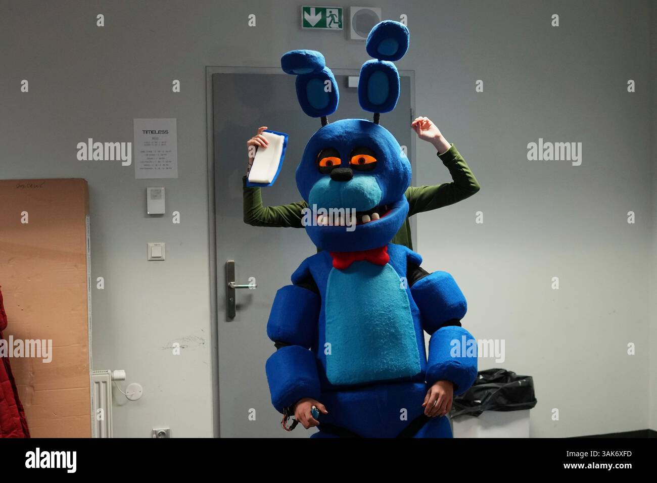 A cosplayer prepares for an audition at a costume contest during the ...