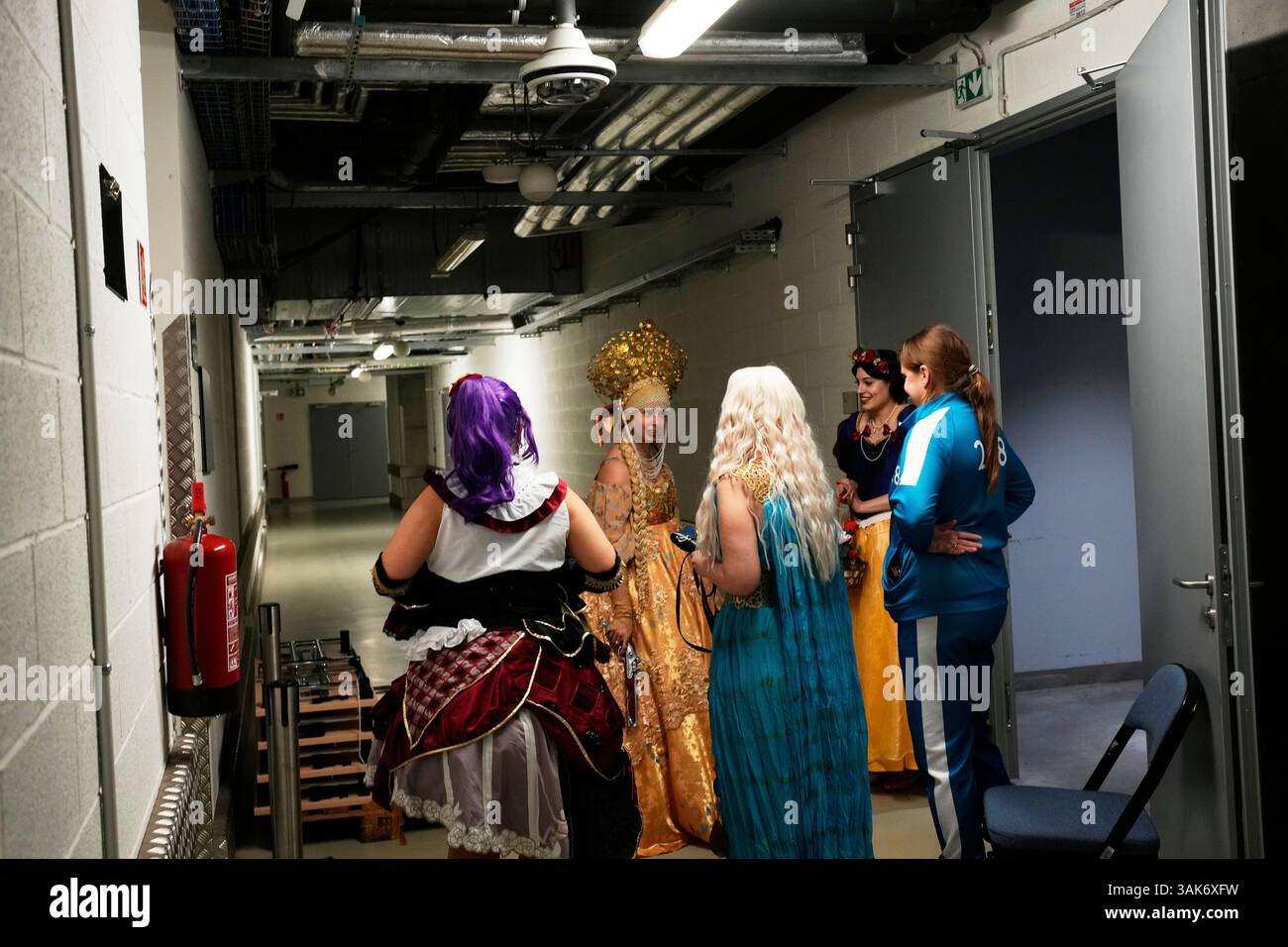 Cosplayers talk in a hallway as they attend the Comic Con event in ...