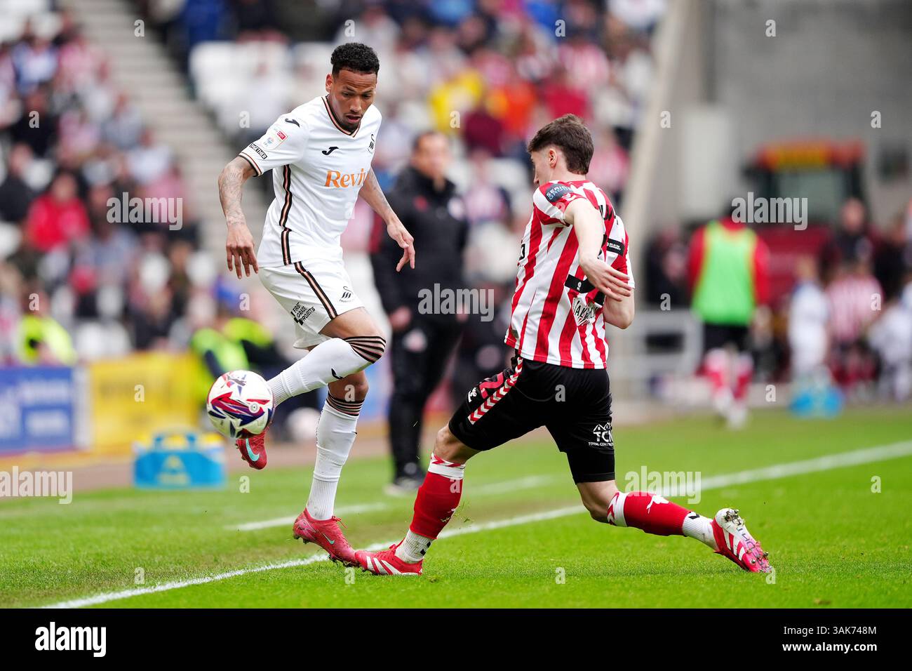 Sunderland's Trai Hume (right) and Swansea City's Ronald battle for the ...