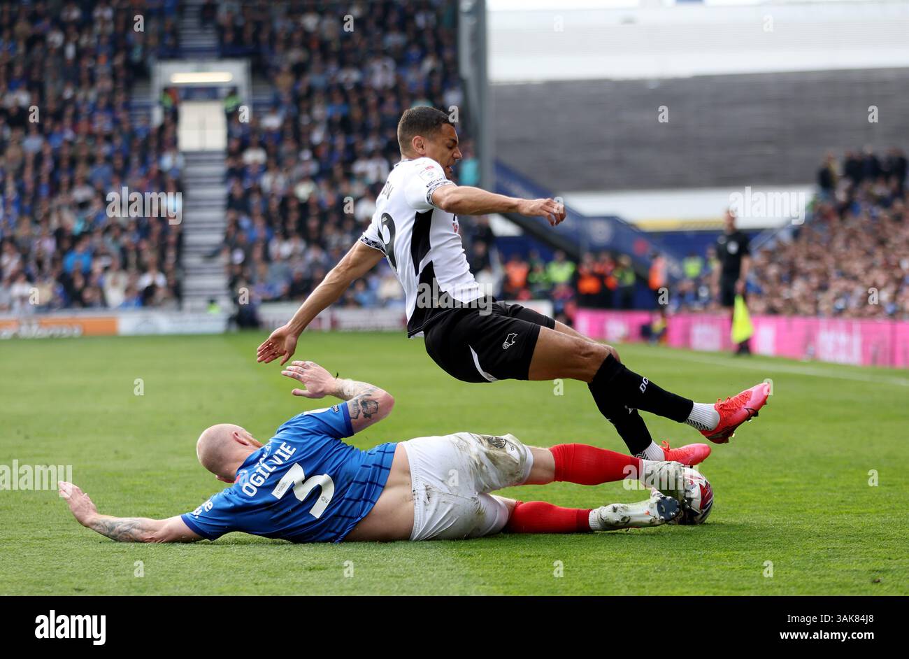 Derby County's Kayden Jackson (right) and Portsmouth's Connor Ogilvie ...