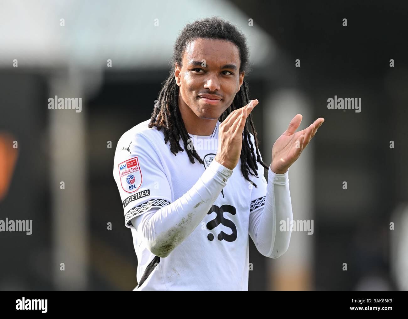 Port Vale's Rico Richards applauds fans at full time following the Sky ...