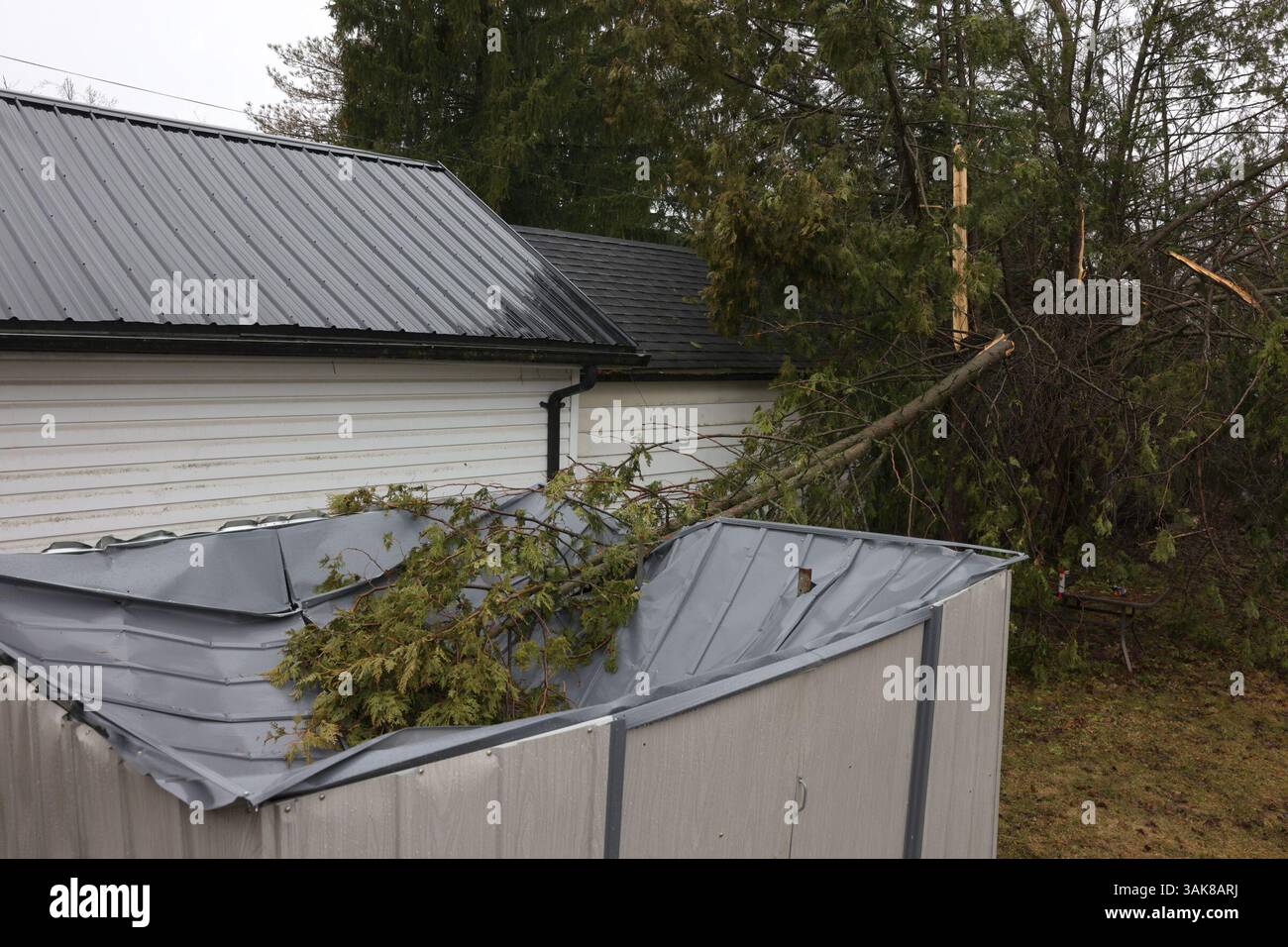 A damaged backyard shed in Peterborough, Ont., Friday, April 11, 2025 ...