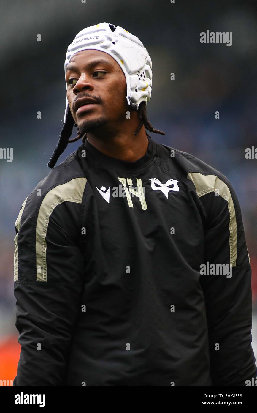 Swansea, Wales, UK. 12th April, 2025. Daniel Kasende of Ospreys warms ...