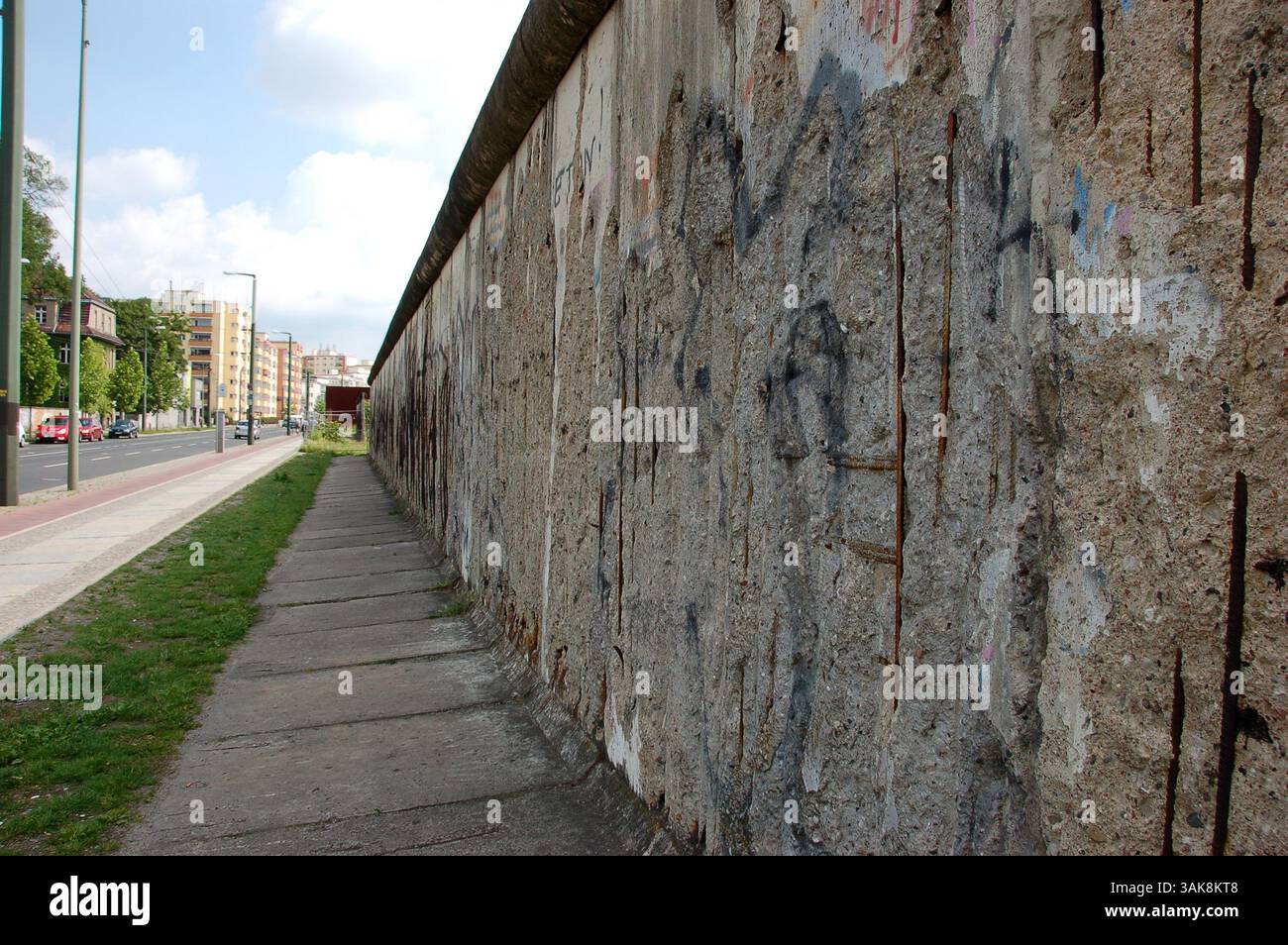Remains of the Berlin Wall with visible rebar and graffiti, taken in ...