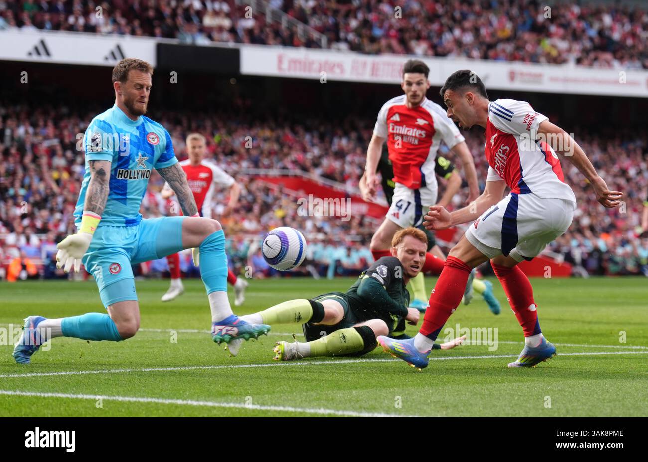 Arsenal's Gabriel Martinelli has a shot saved by Brentford goalkeeper ...