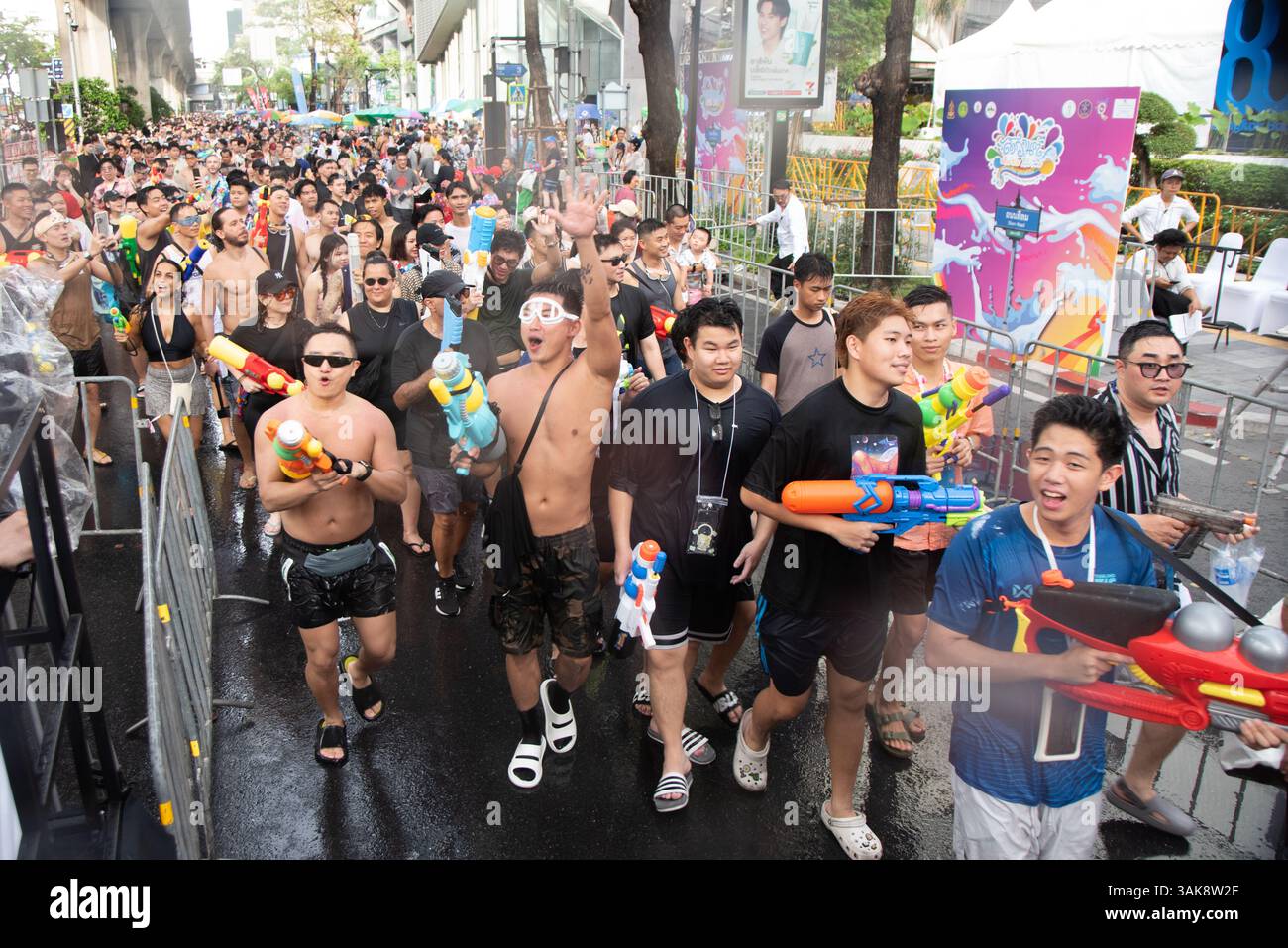 People Enjoying water gun fight during Songkran Festival at Silom Road ...
