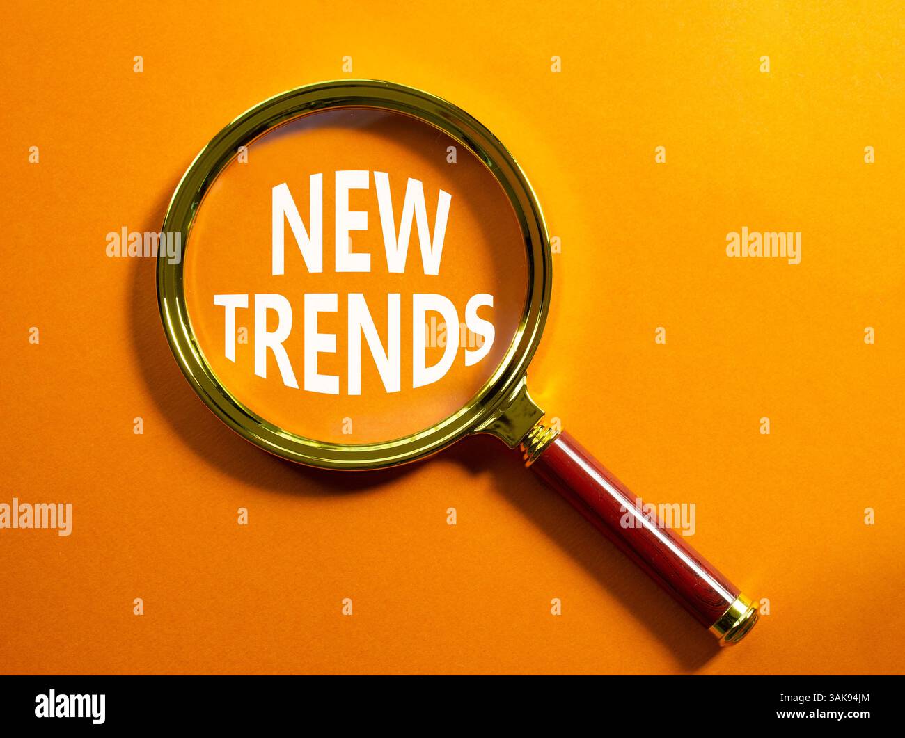New Trends symbol. Magnifying glass with words New Trends. Beautiful ...