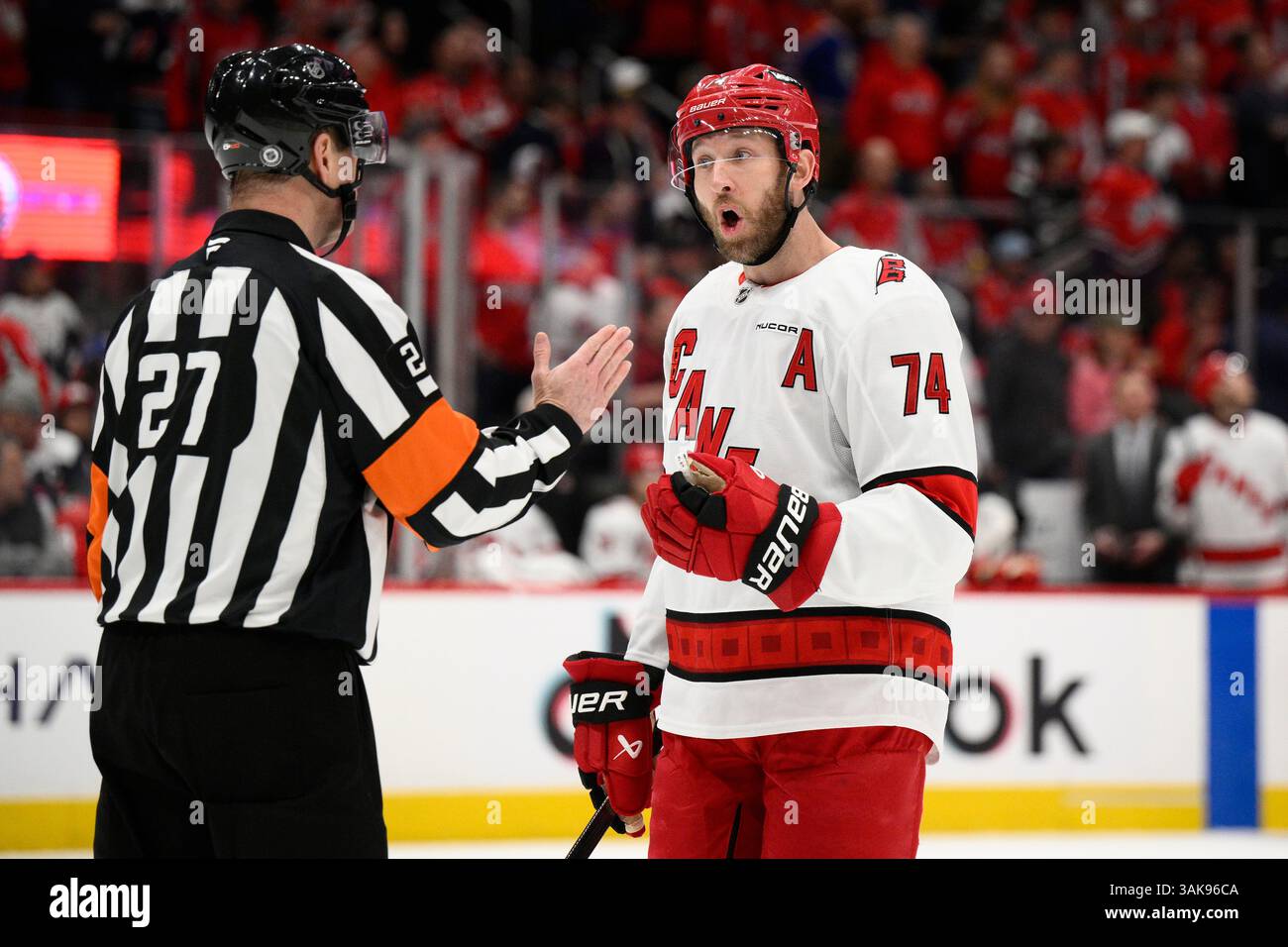 Carolina Hurricanes defenseman Jaccob Slavin (74) talks with an ...