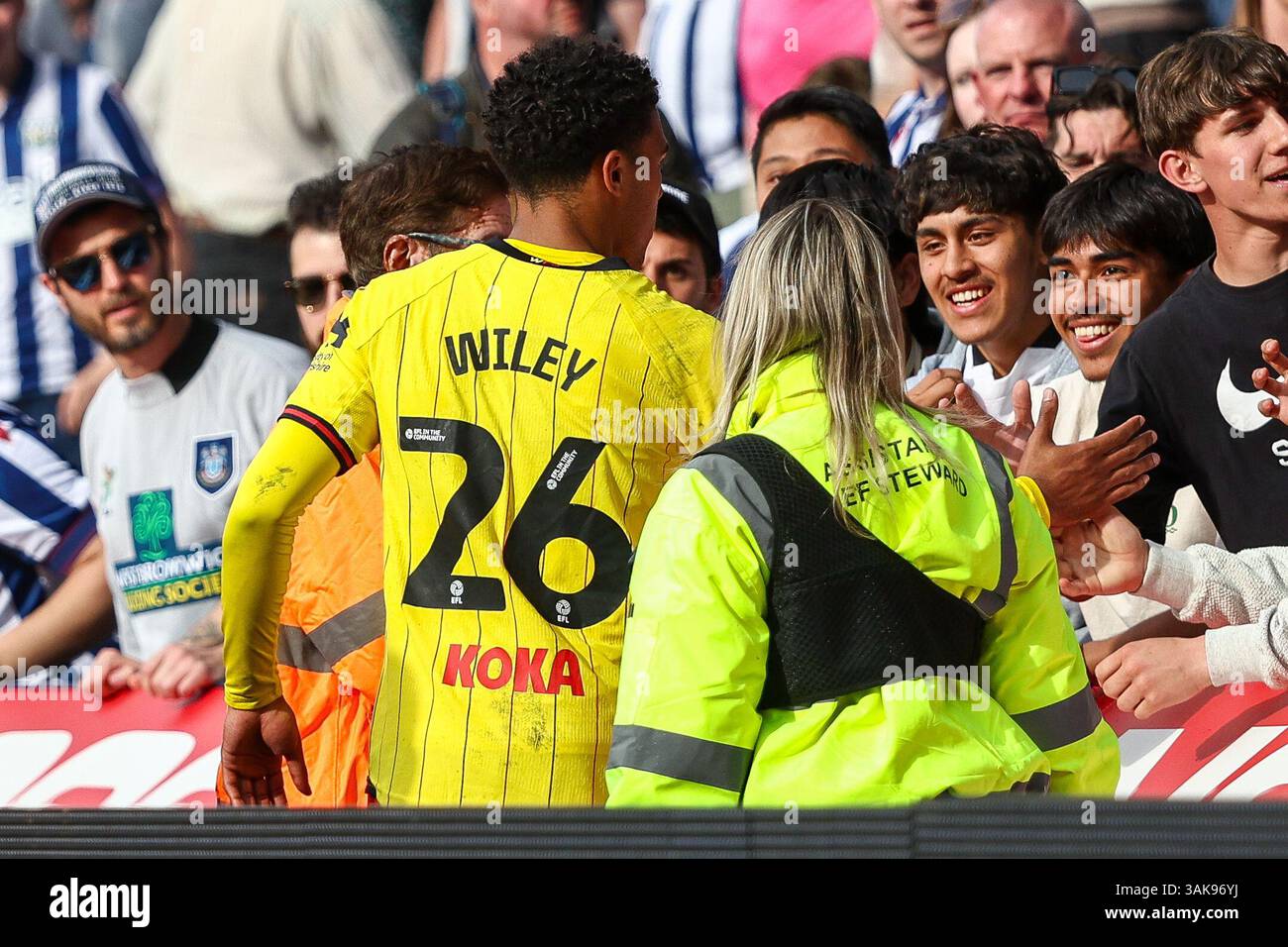 #26, Caleb Wiley of Watford heads for a selfie & to sign autographs ...