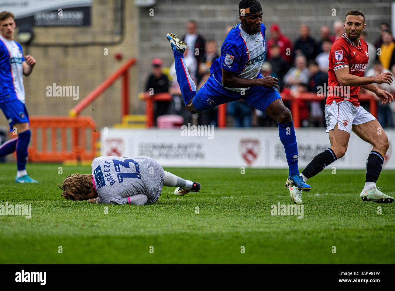 Carlisle United's Aaron Hayden leaps over his Goalkeeper Carlisle ...