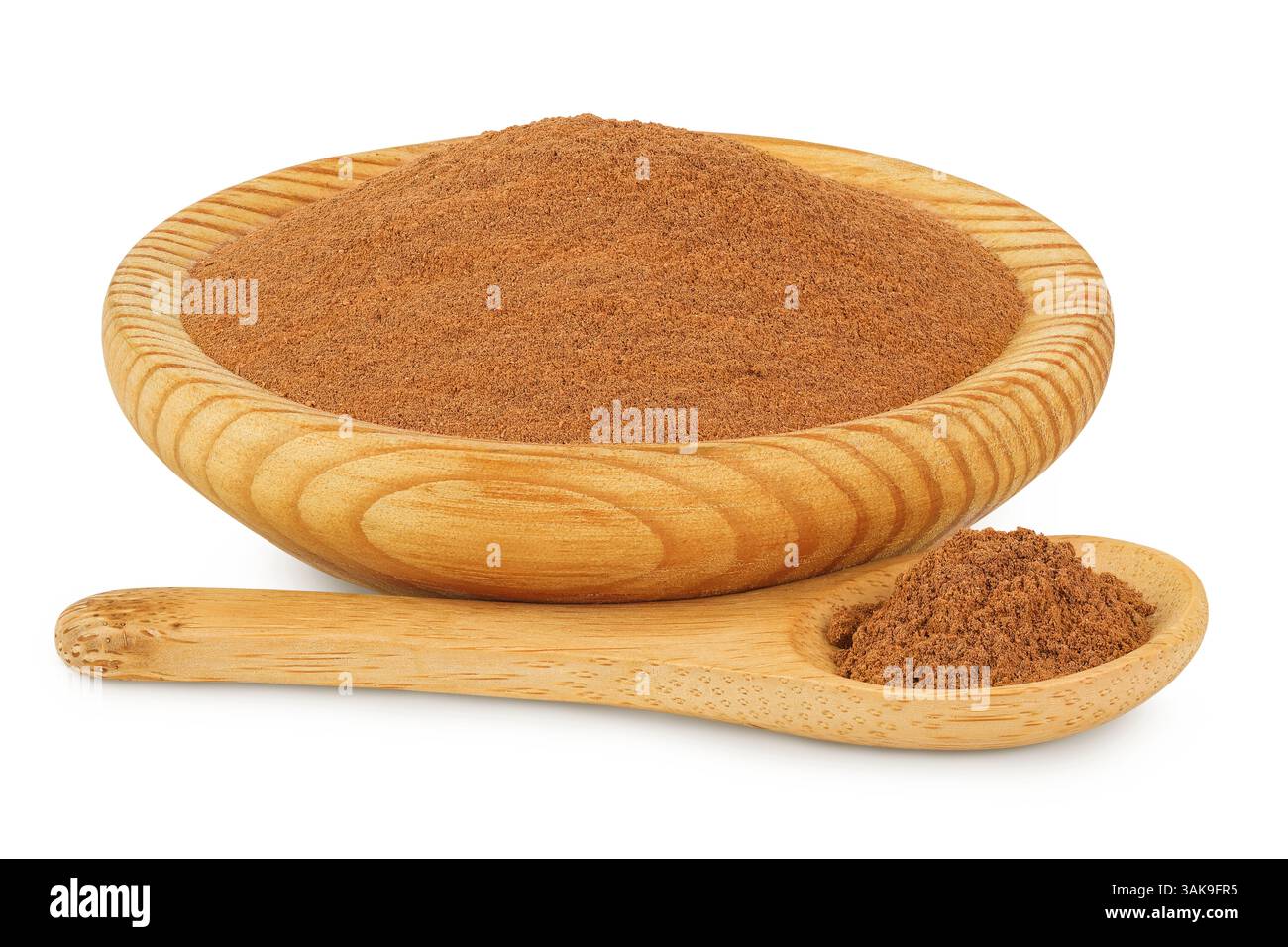 Cinnamon powder in wooden bowl and spoon isolated on white background ...