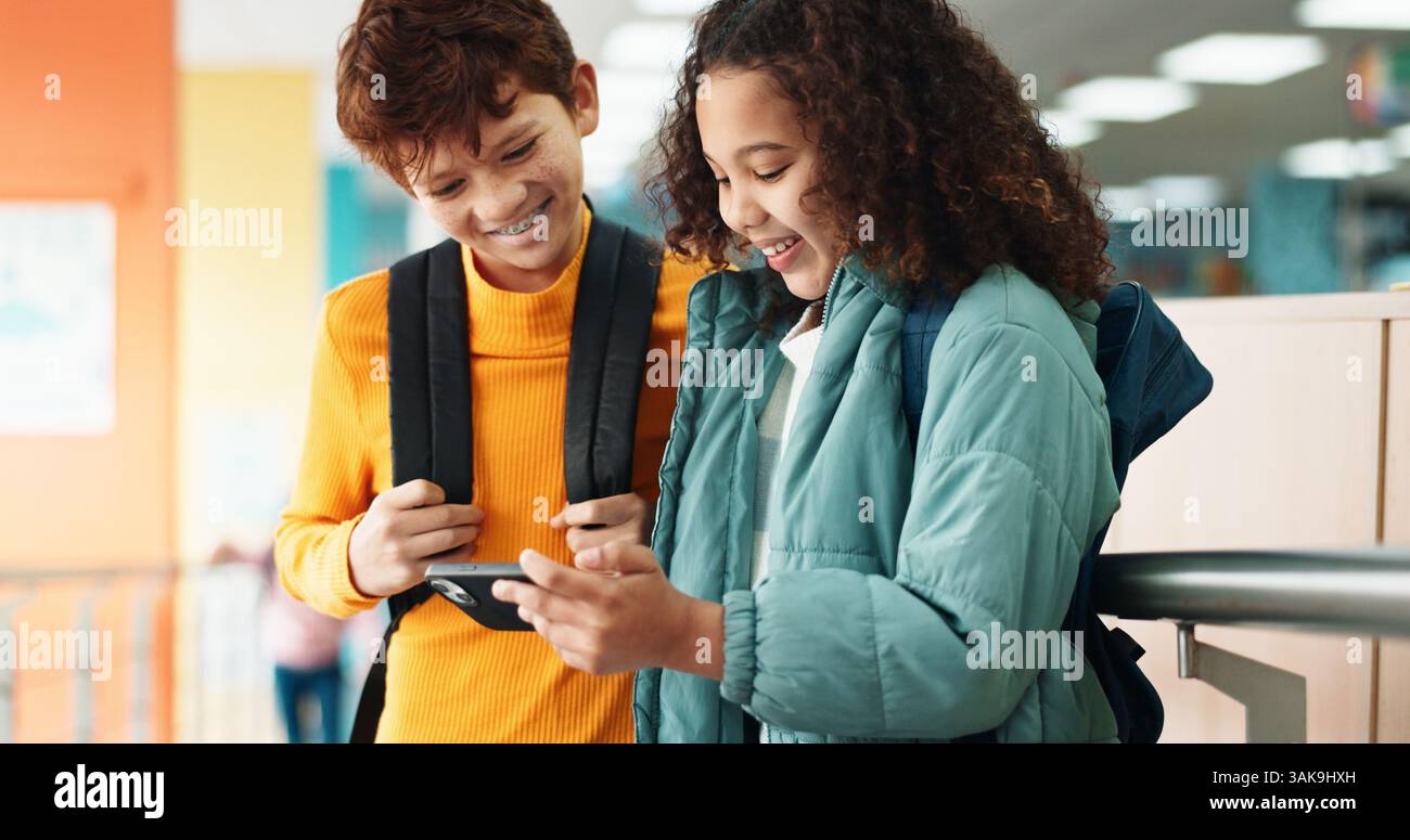 Happy, children and friends with phone at school watching comedy, funny ...