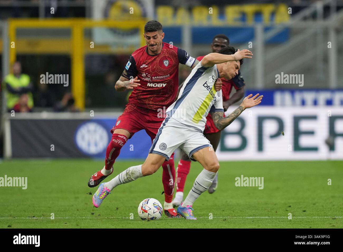 Inter Milan's Joaquin Correa, right, is challenged by Cagliari's ...