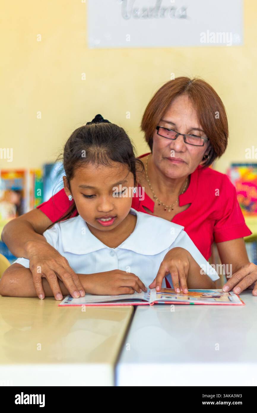 A public elementary school teacher in Batangas, Philippines teaches her ...