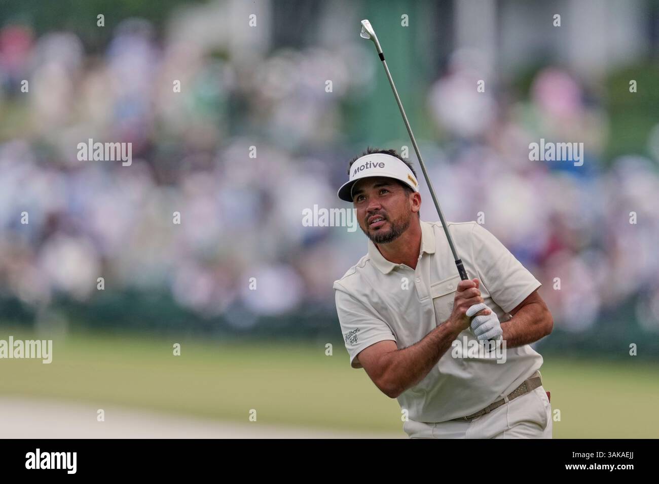 Jason Day, of Australia, watches his shot on the first hole during the ...