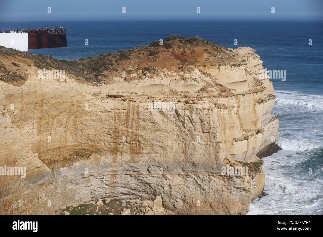 Visitors seen at the cliffside viewpoint overlooking the Twelve ...