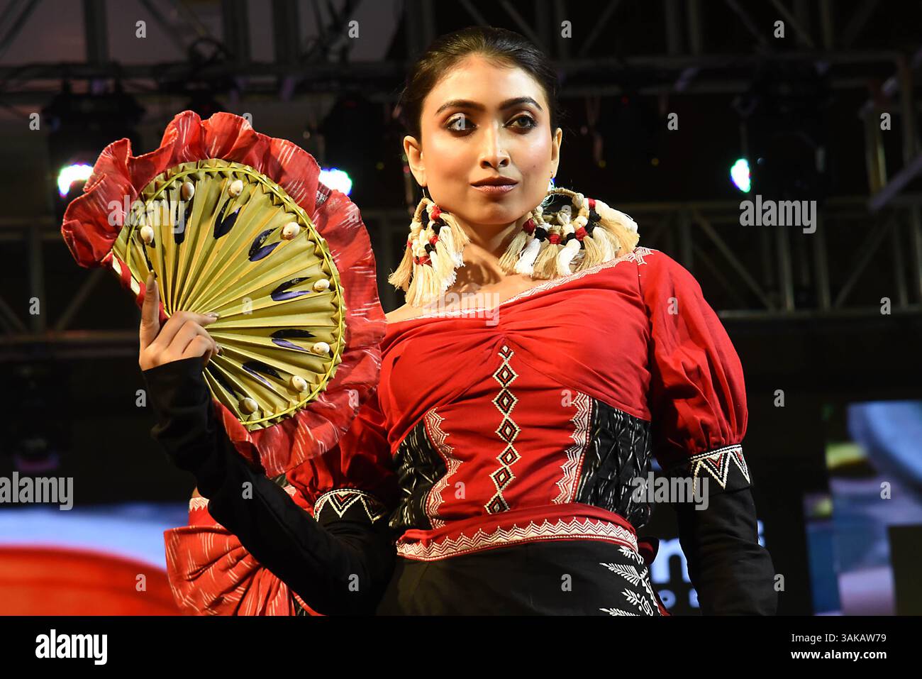 An Indian model displays the new summer collection at the NIF Global Elixir 2025 Fashion Show in ...