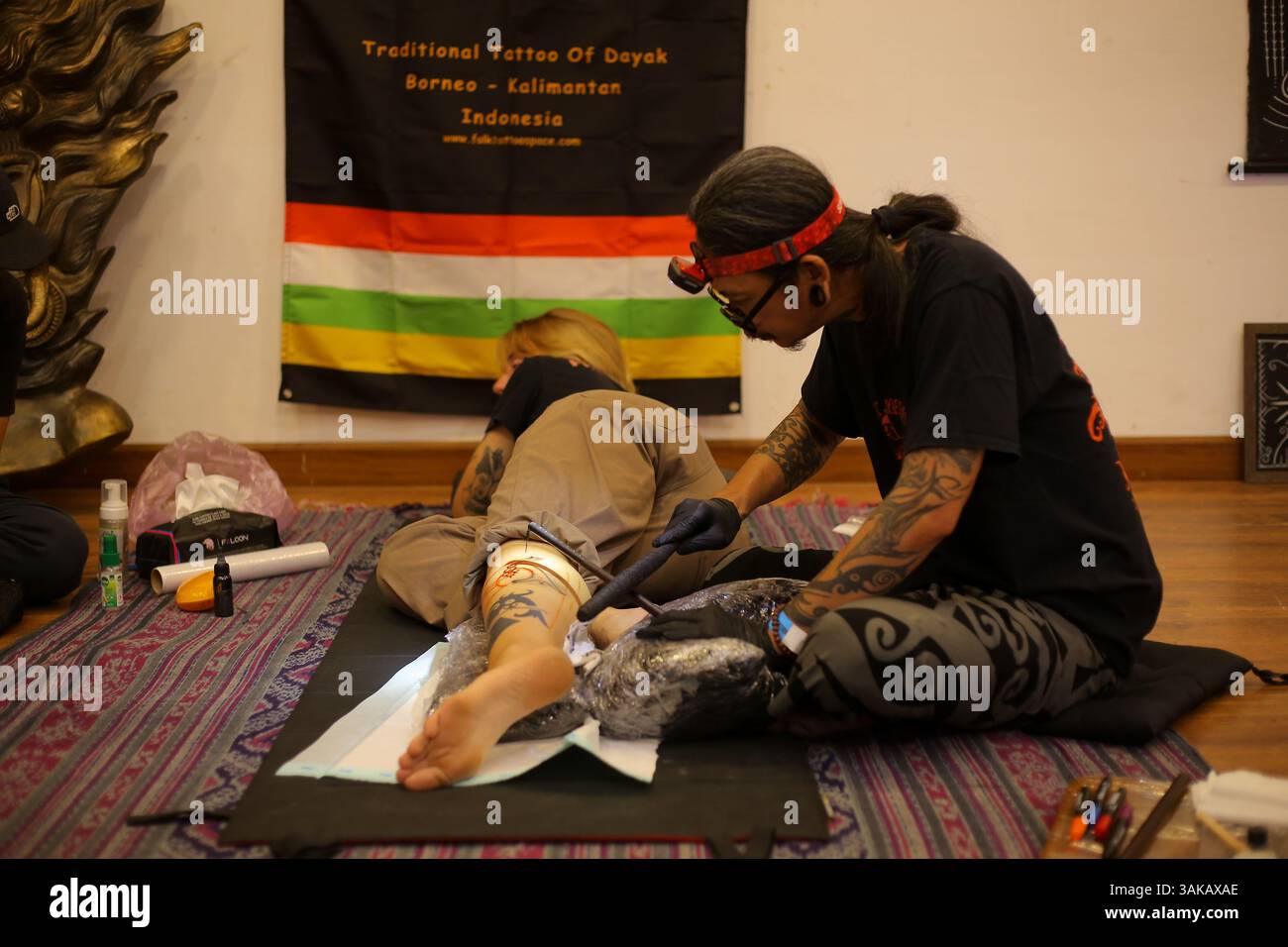 Tattoo artists and enthusiasts get tattooed during the ''Nepal Tattoo ...