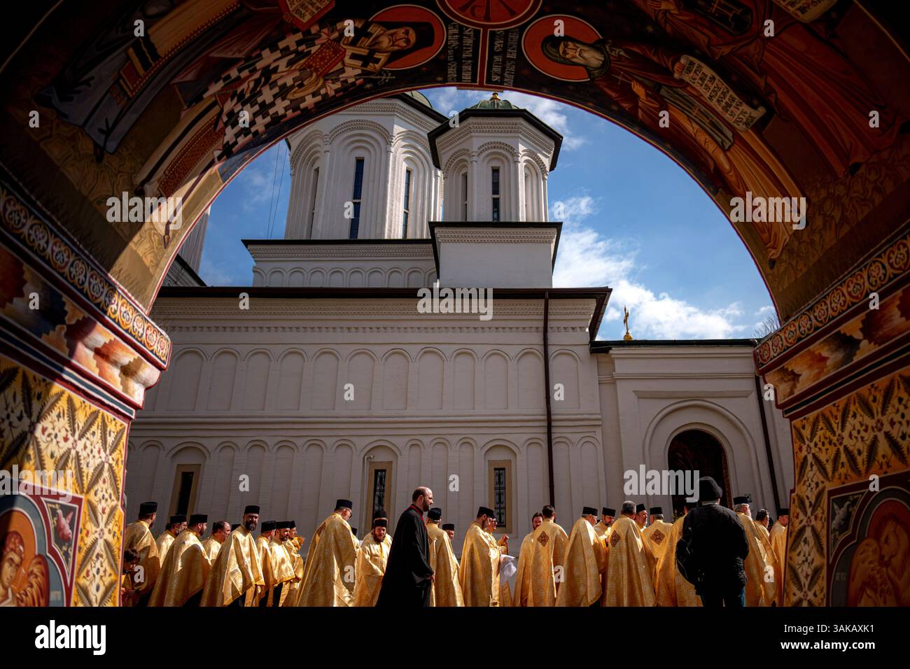 Romanian Orthodox priests and believers walk during an Orthodox Palm ...