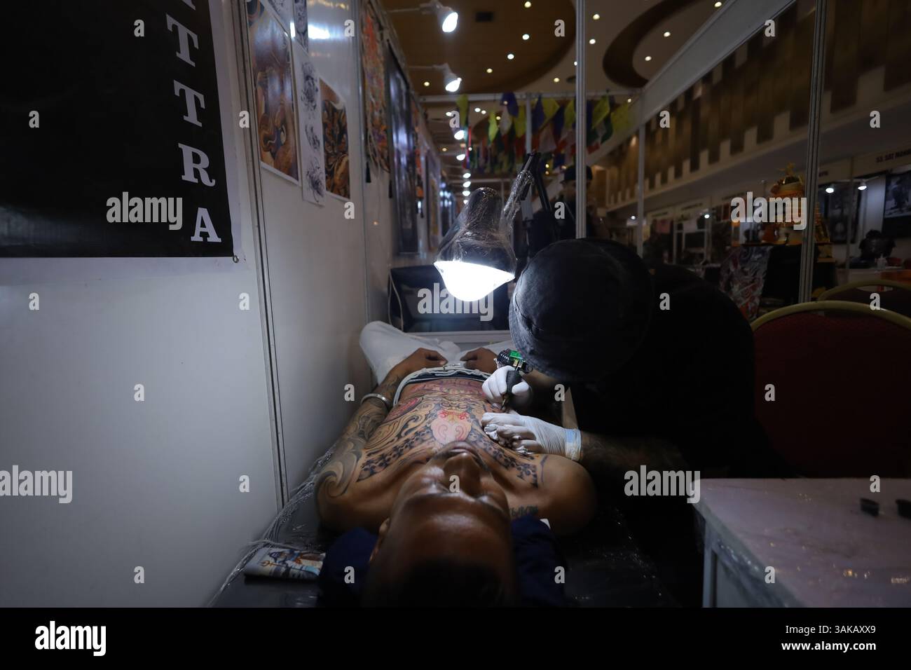 Tattoo artists and enthusiasts get tattooed during the ''Nepal Tattoo ...