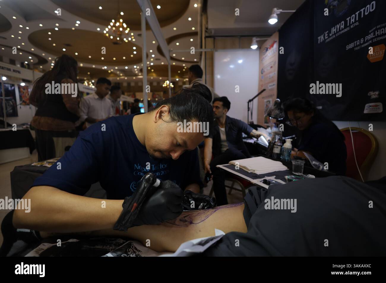 Tattoo artists and enthusiasts get tattooed during the ''Nepal Tattoo ...