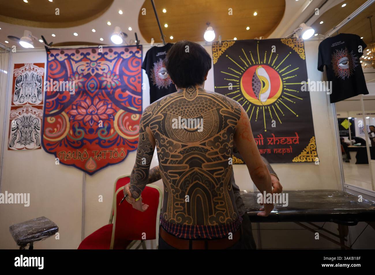 Tattoo artists and enthusiasts get tattooed during the ''Nepal Tattoo ...