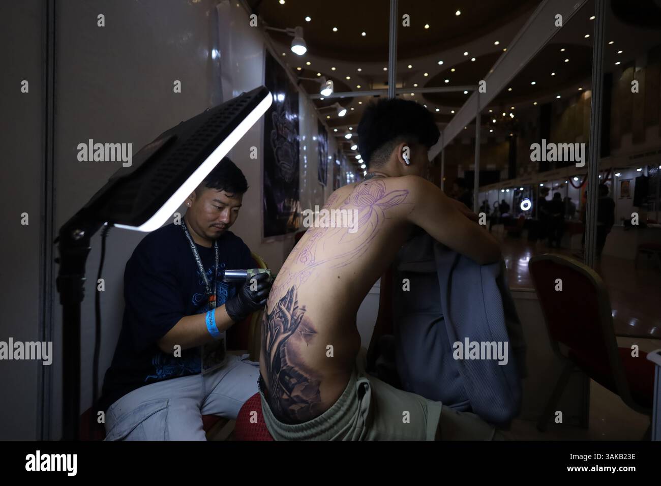 Tattoo artists and enthusiasts get tattooed during the ''Nepal Tattoo ...