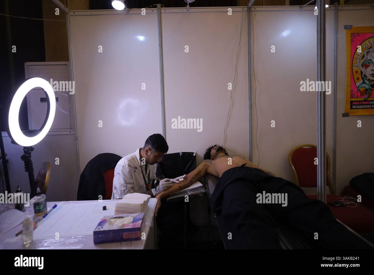 Tattoo artists and enthusiasts get tattooed during the ''Nepal Tattoo ...